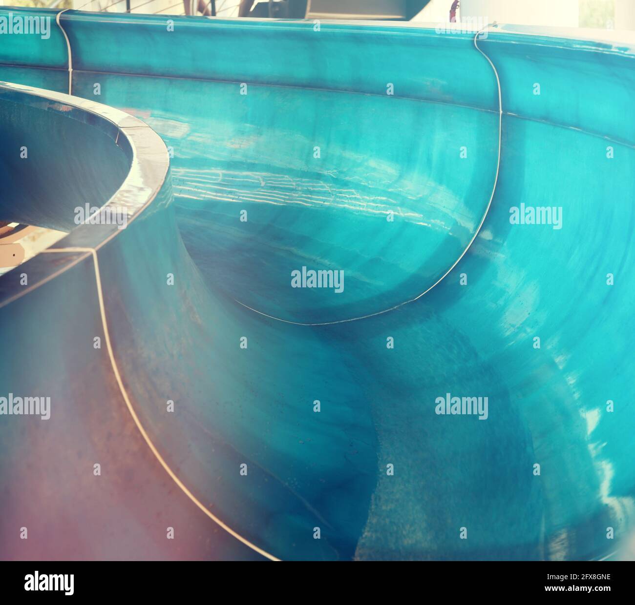 Blue slide in a water park Stock Photo - Alamy