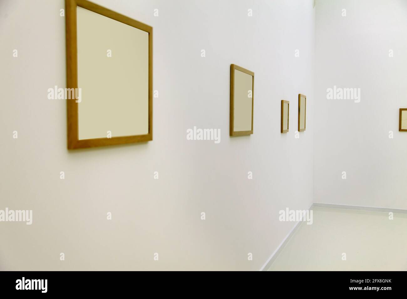 Empty picture frames hanging on the wall in an exhibition hall Stock ...