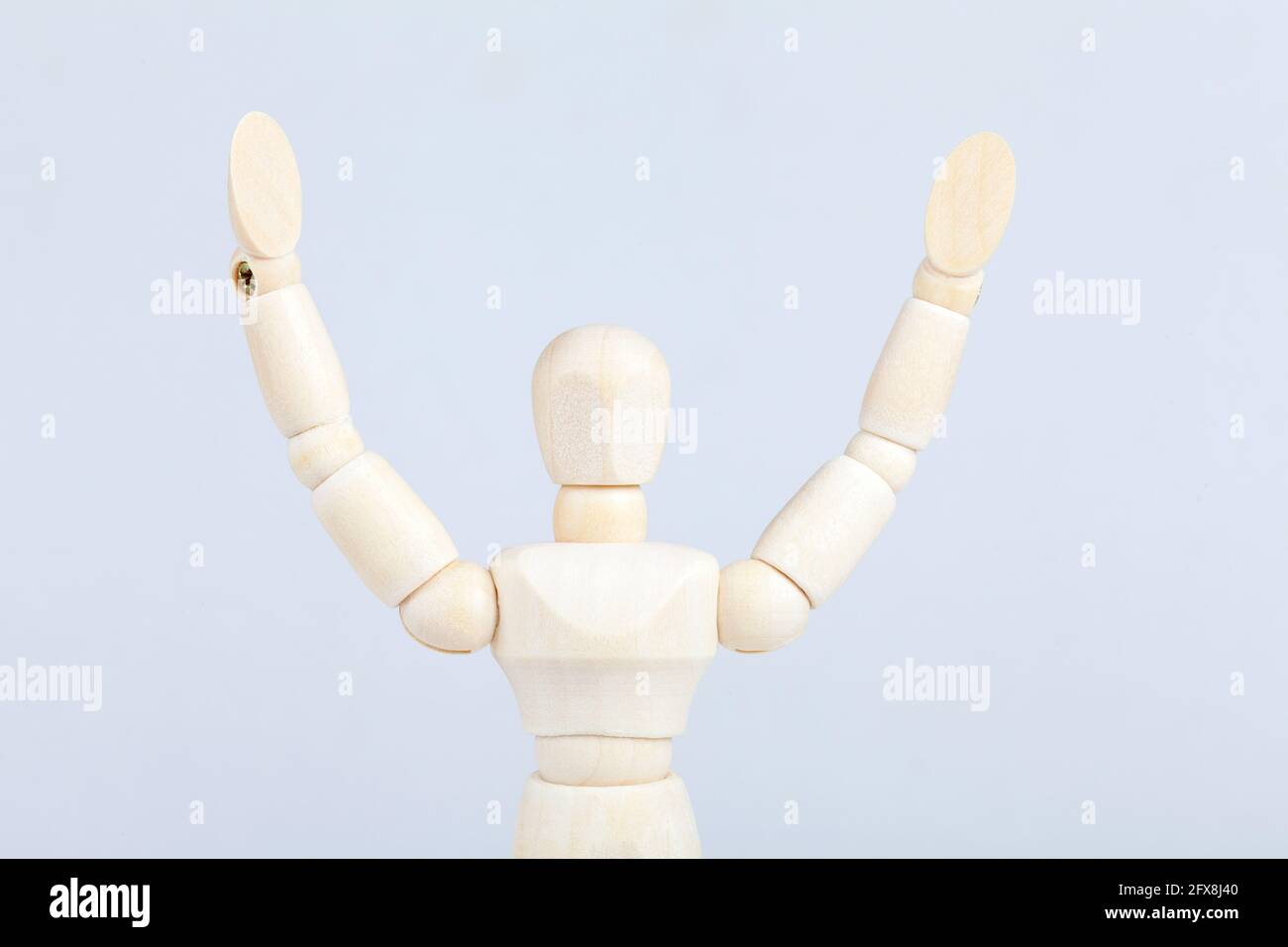 Wooden figurine, doll, man surrendering or celebrating, throwing hands ...