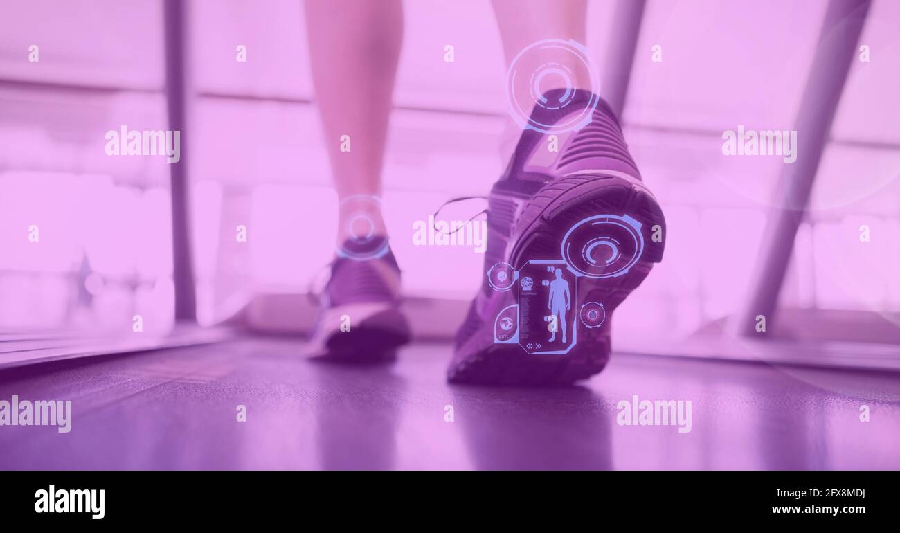 Composition of digital interface over woman's legs exercising on ...