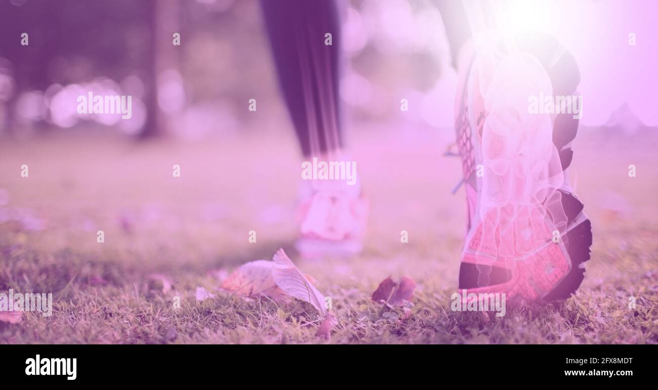 Composition of woman's legs running with visible x ray bones and pink ...