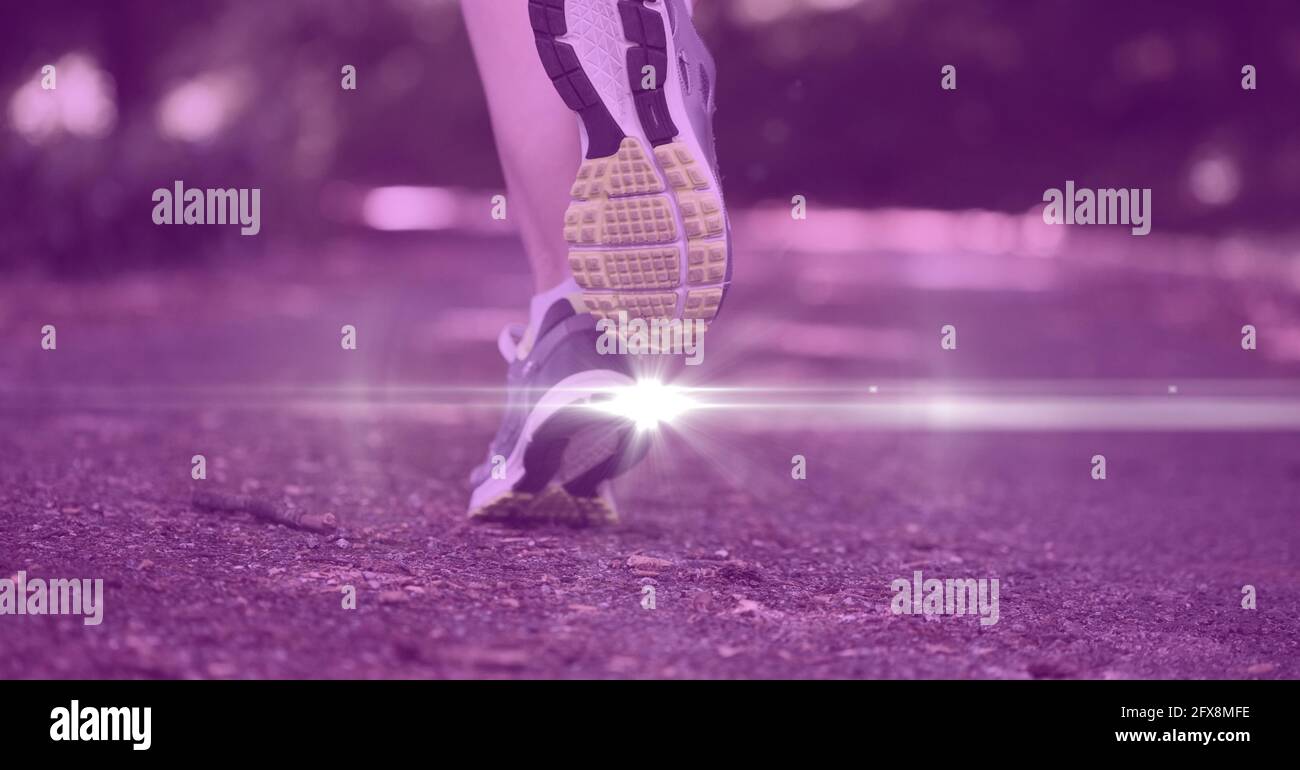 Composition of woman's legs running with glowing light and pink tint ...