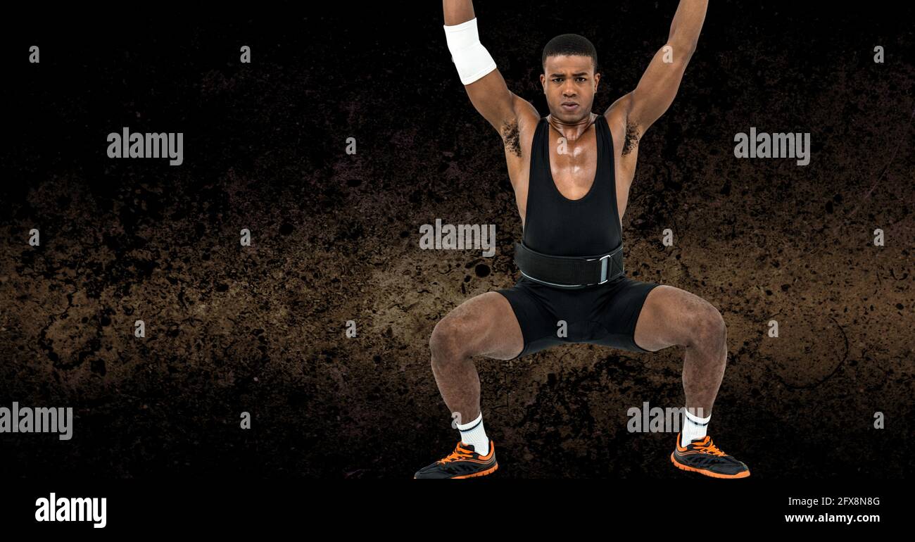Composition of strong african american man crouching and lifting ...