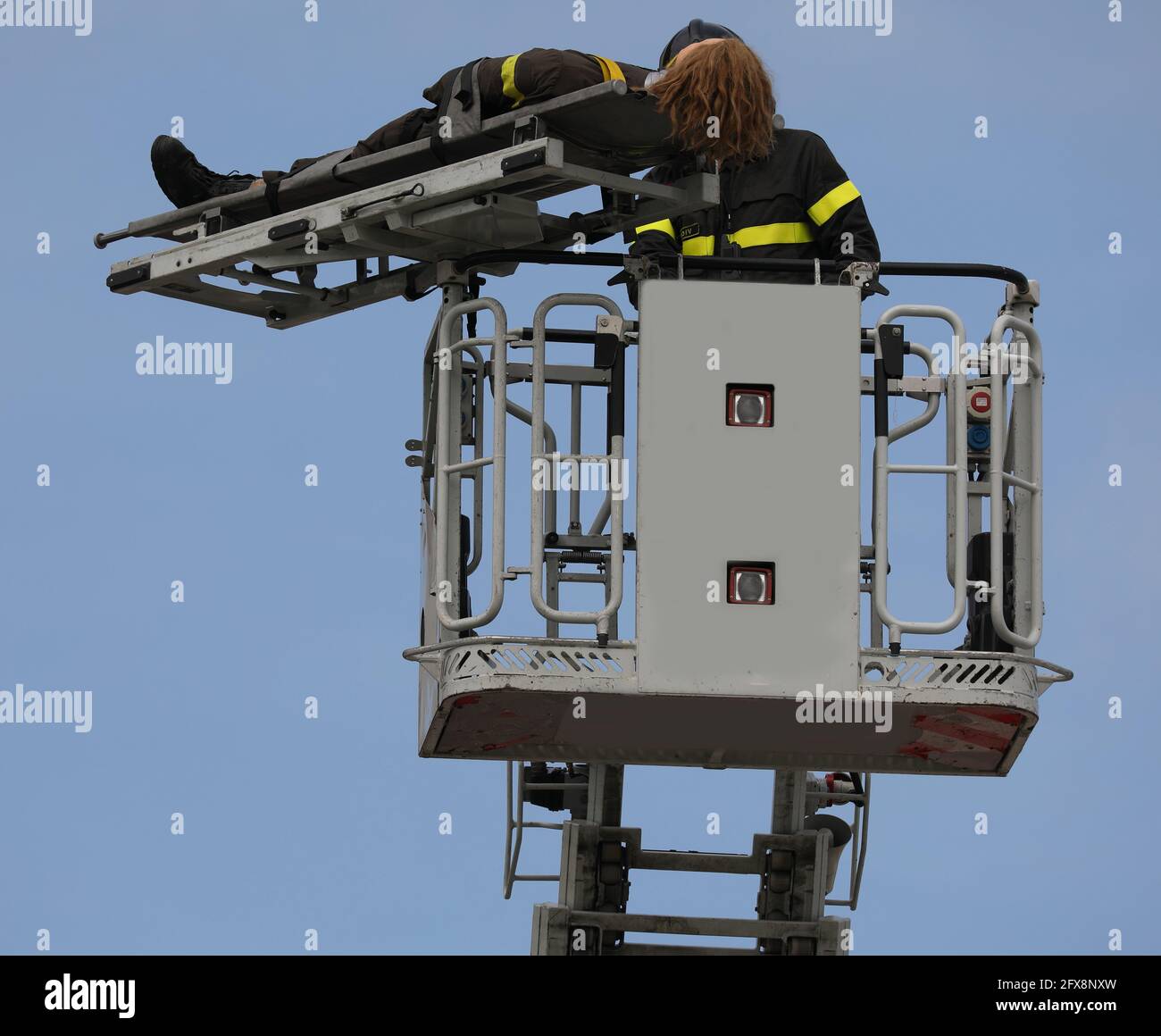 basket of the aerial platform during the rescue maneuver of an injured ...