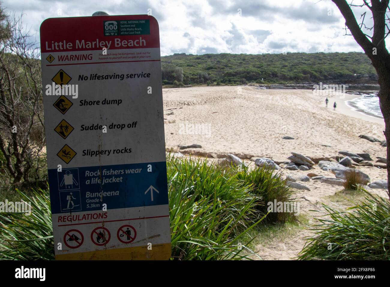 Little Marley Beach, a scenic, remote beach with large rocks in the ...