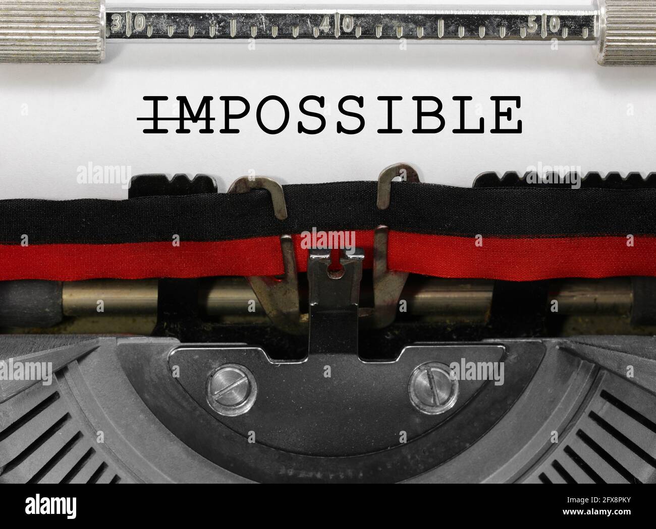 Word Impossible with letters IM deleted writen with an old vintage ...