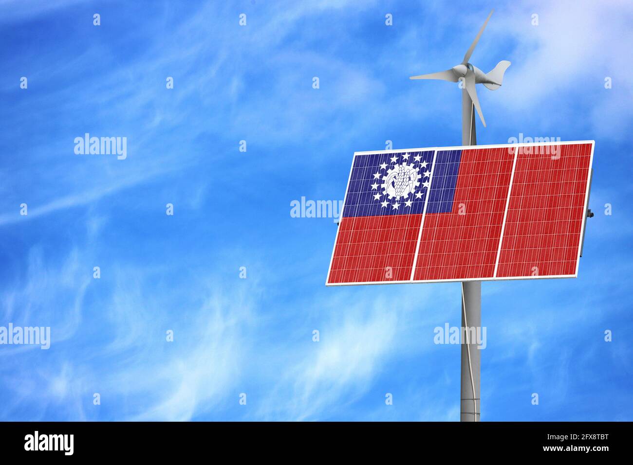 Solar panels against a blue sky with a picture of the flag of Myanmar ...