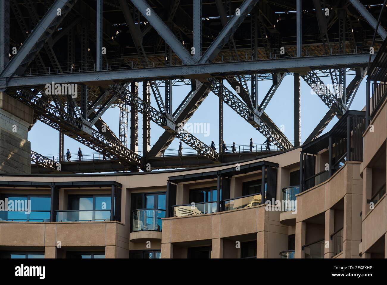 Tourists are on their way to the Sydney Harbour Bridge Climb. Below is ...
