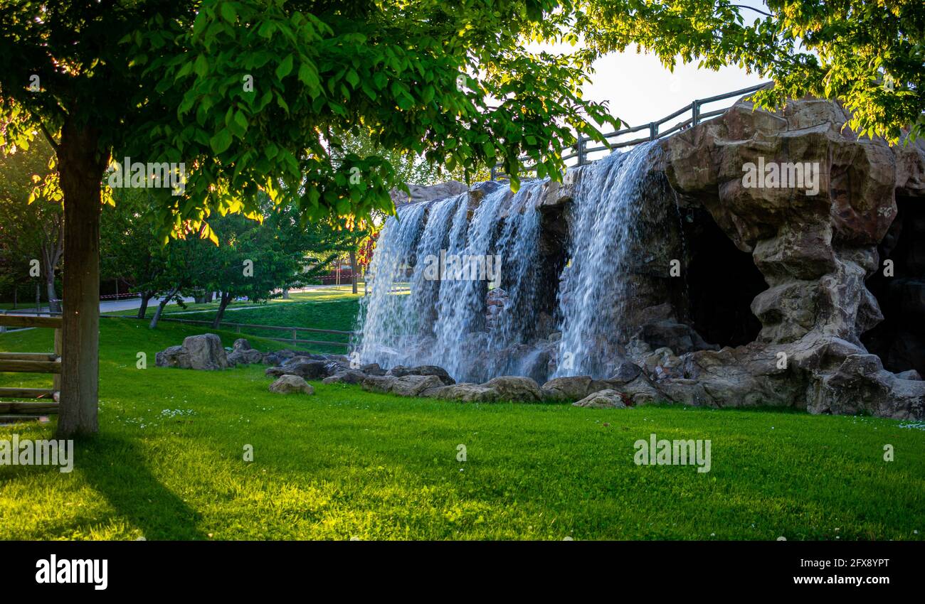 Beautiful view of a powerful waterfall in a park Stock Photo - Alamy