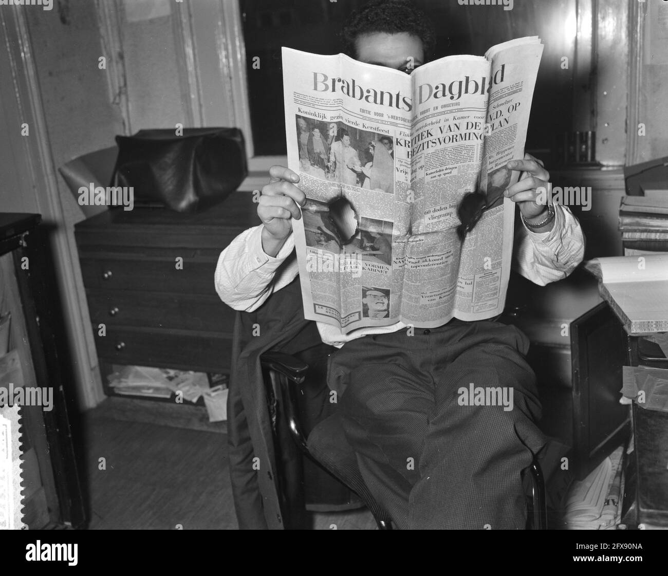 Man reads partially burned newspaper hi-res stock photography and ...
