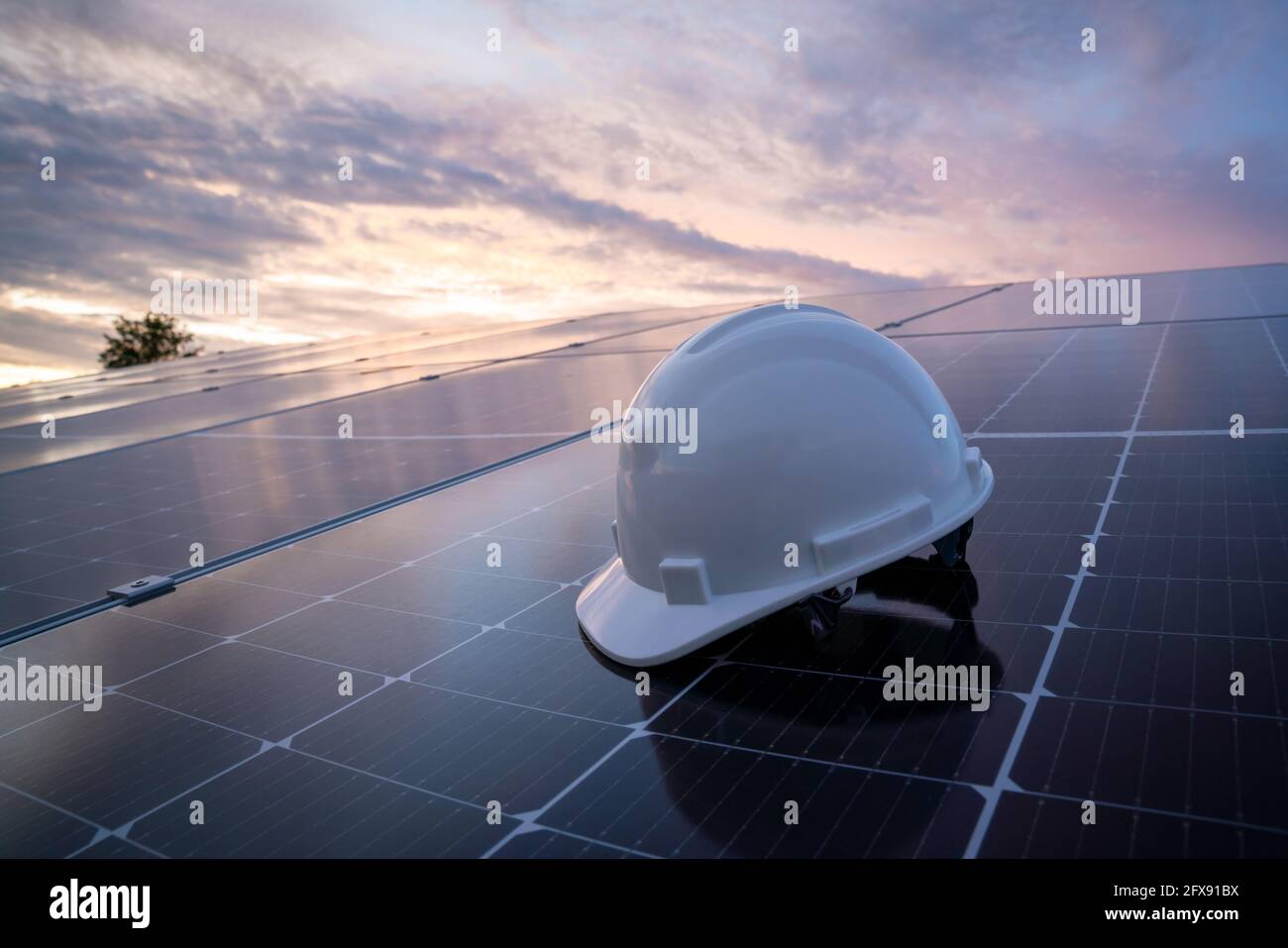 helmet of engineer working on checking equipment in solar power plant ...