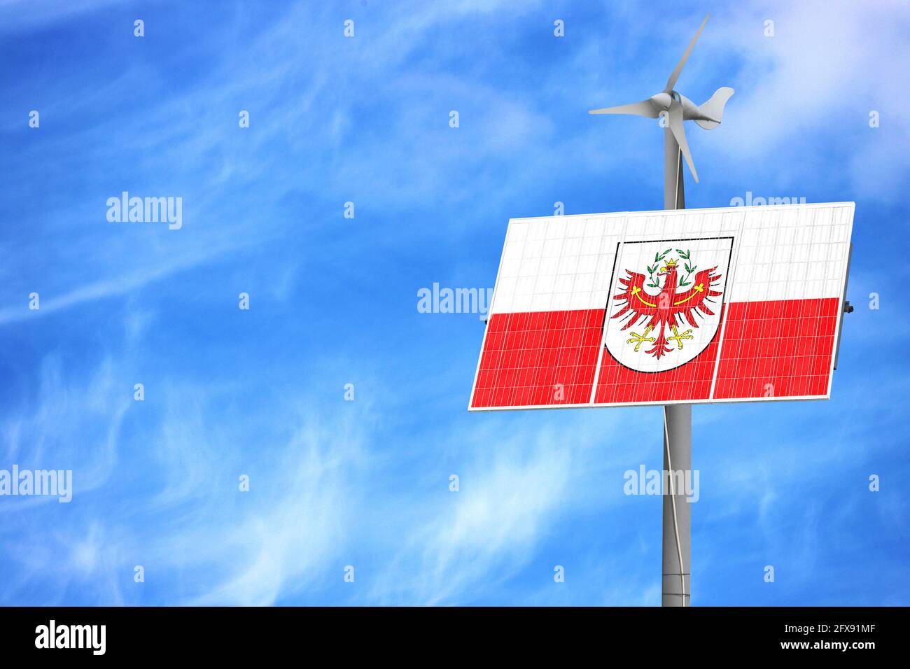Solar panels against a blue sky with a picture of the flag of Tyrol ...