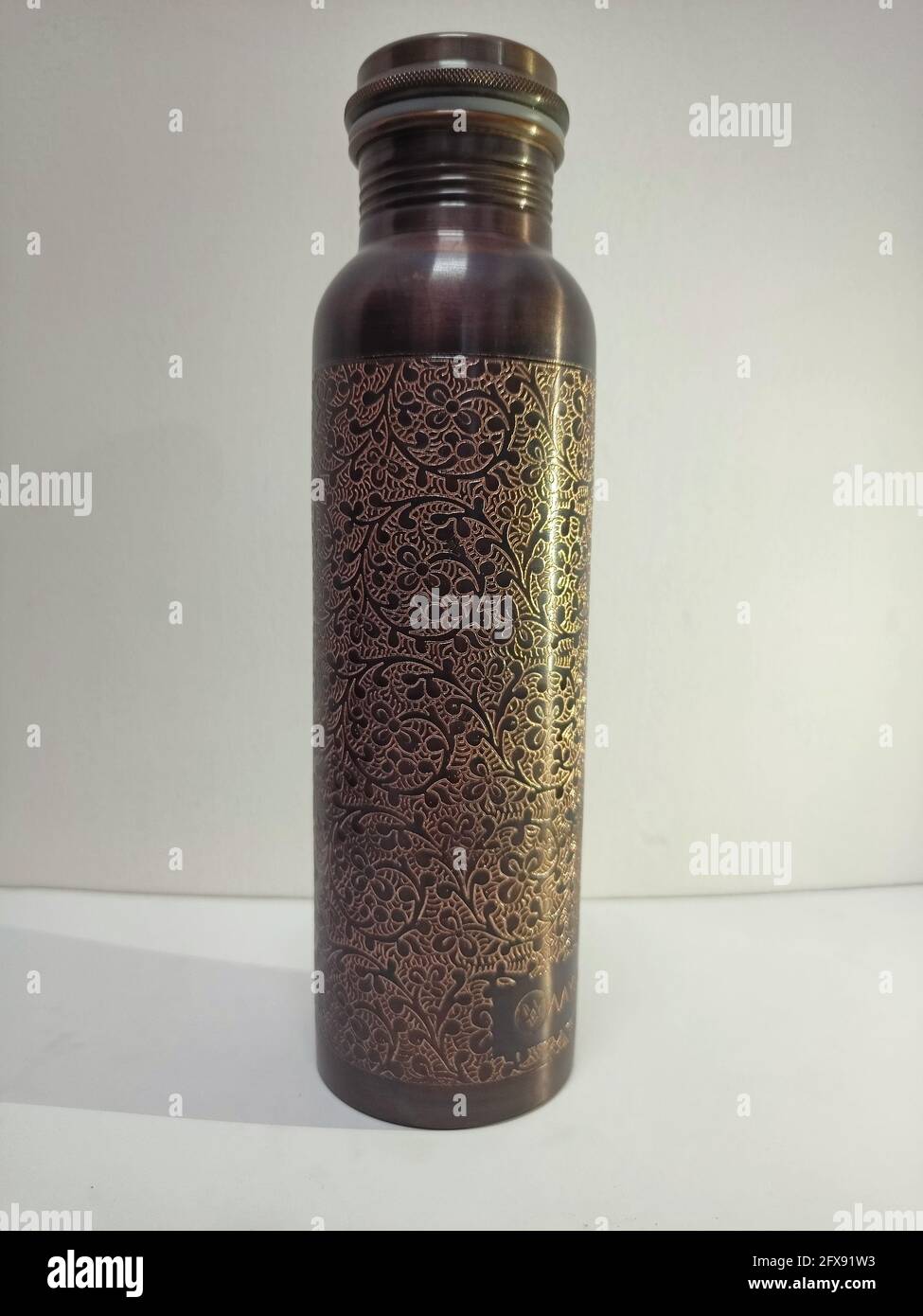 Vertical shot of a decorative copper water bottle Stock Photo - Alamy