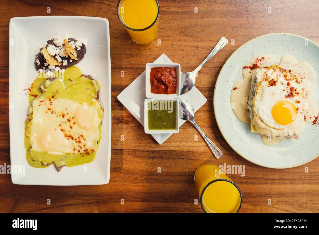 Top view of a healthy breakfast table for two with fresh egg dishes ...