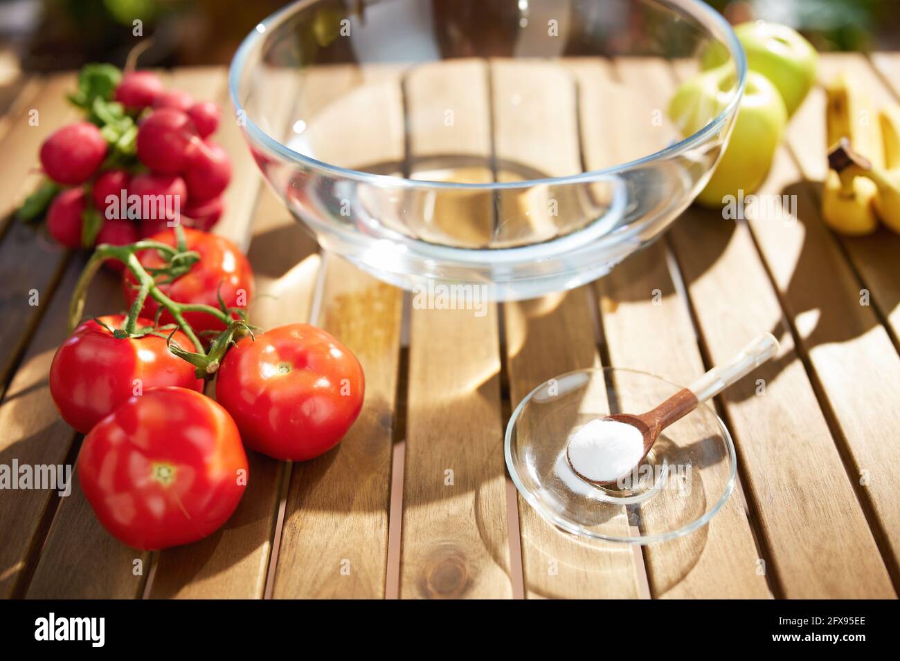 baking soda and vegetables and fruits on table in modern kitchen Stock ...