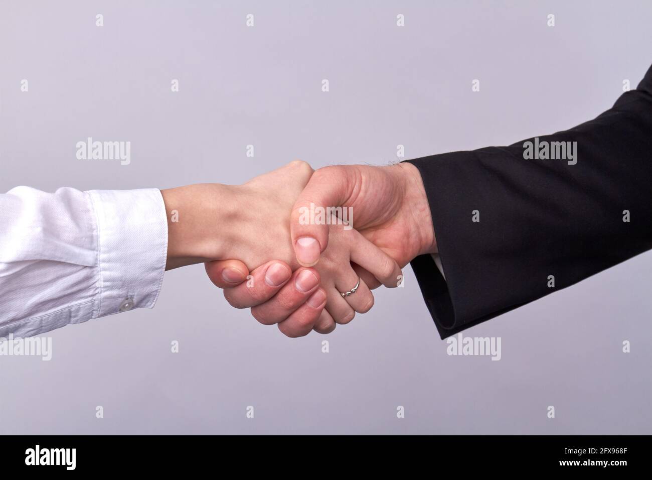 Close up handshake of male and female hands Stock Photo - Alamy
