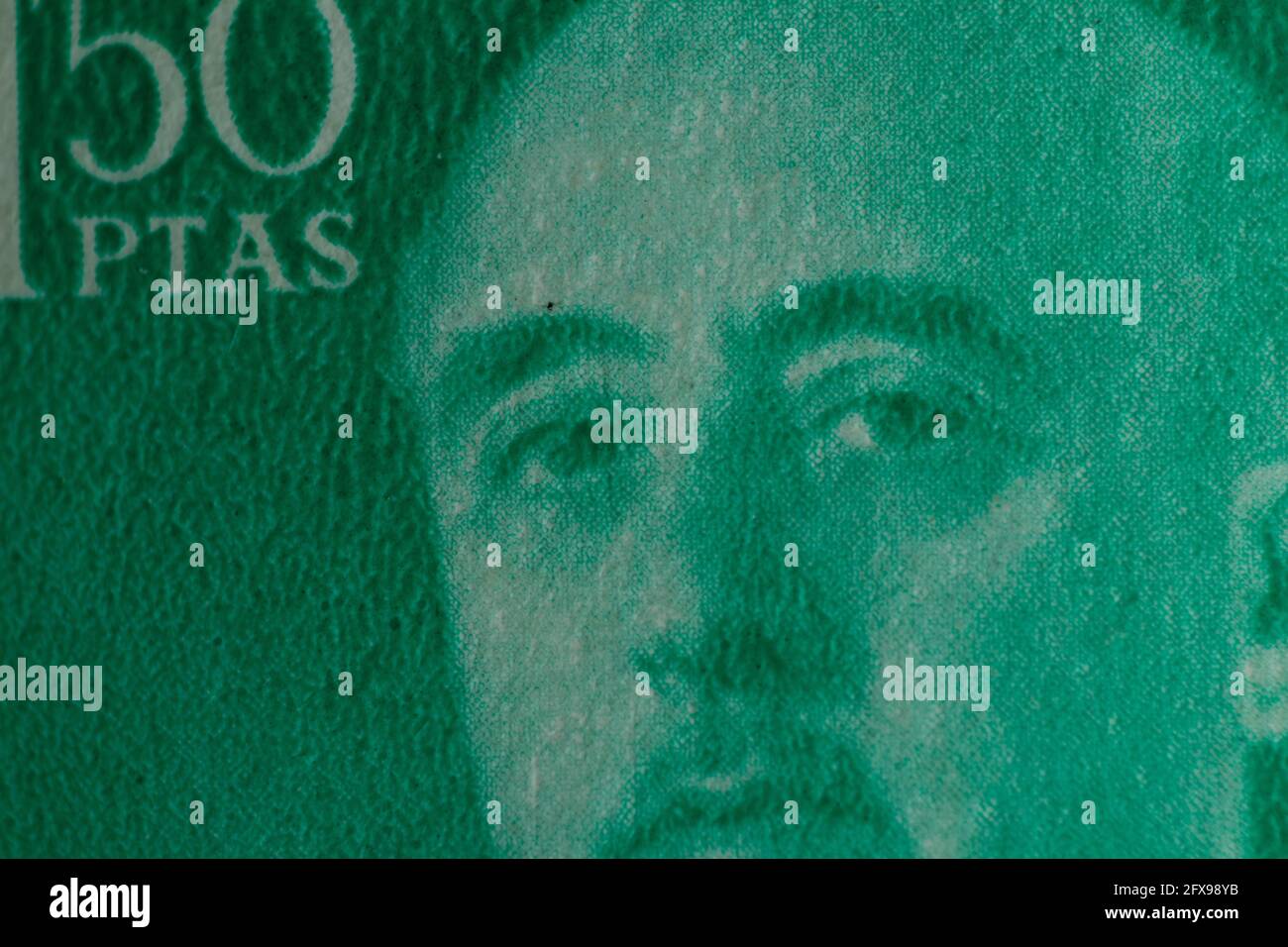 Closeup view of a man's face on an old green banknote of Spanish Ptas ...