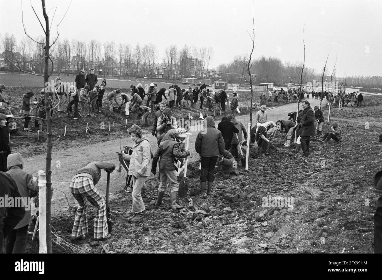 People Planting Trees In Black And White
