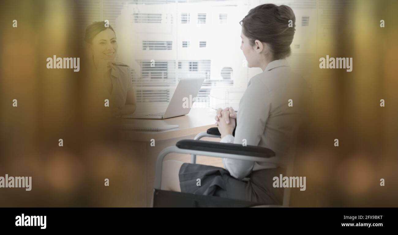 Composition of two women in office at job interview Stock Photo - Alamy