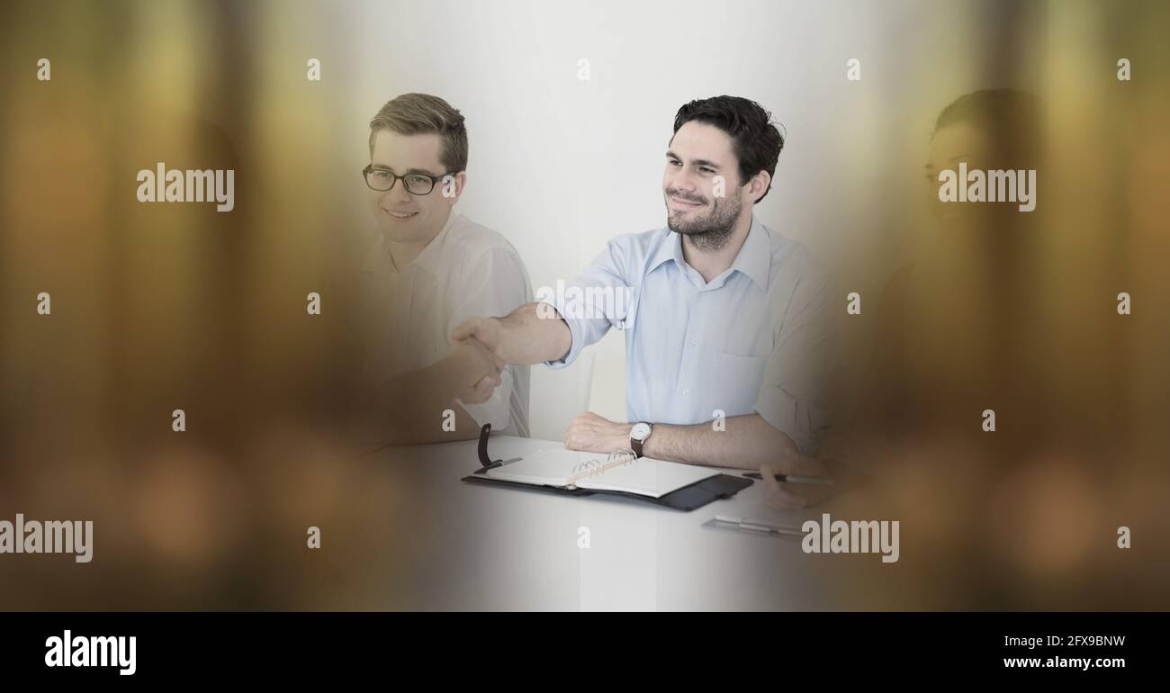 Composition of man shaking hands in office at job interview Stock Photo ...
