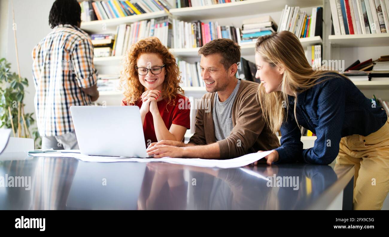 Group of business people and software developers working as a team in ...