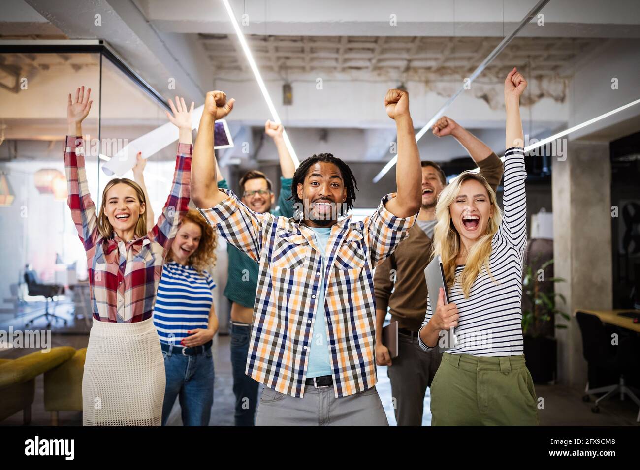 Successful company with happy employees in modern office Stock Photo ...