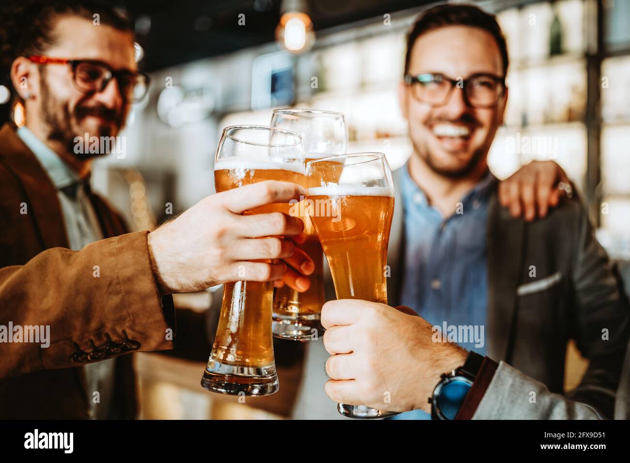 Business people drink beer after work in pub. Businessmen enjoy a beer Stock Photo Alamy