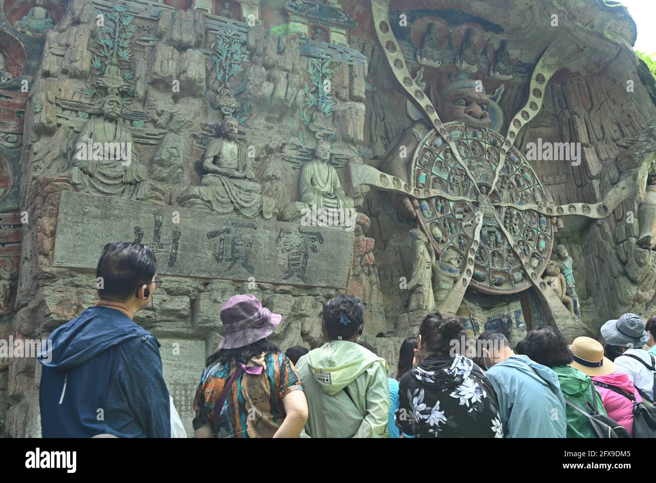 CHONGQING, CHINA - MAY 26, 2021 - Tourists look at exquisite stone ...