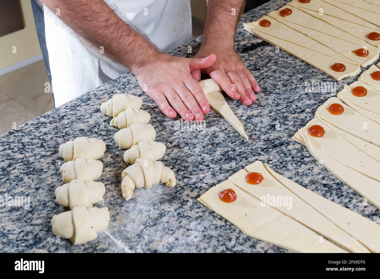Stages of preparation, pastry chef prepares jam croissant in pastry ...
