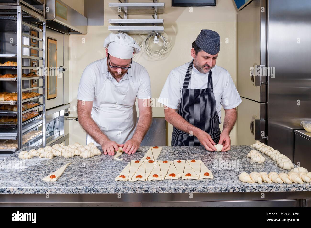 Stages of preparation, pastry chef prepares jam croissant in pastry ...