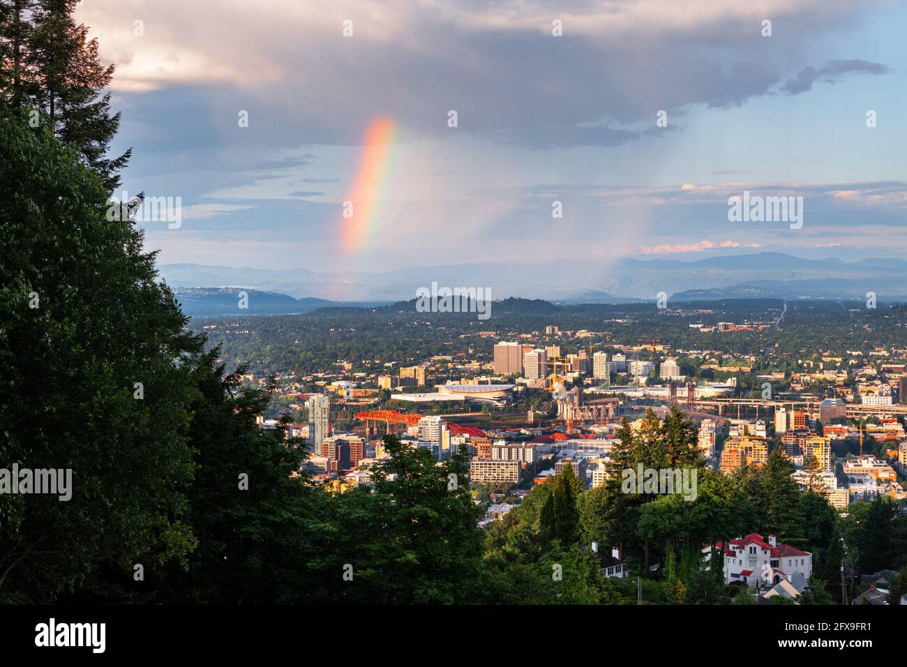 Portland, Oregon, USA downtown cityscape with a sun shower and rainbow ...