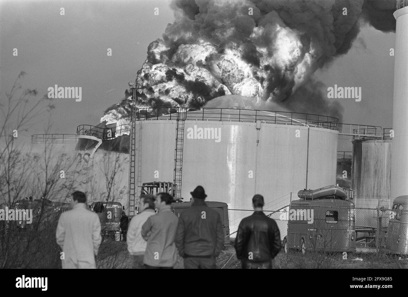 Burning gasoline storage tank amidst Black and White Stock Photos ...