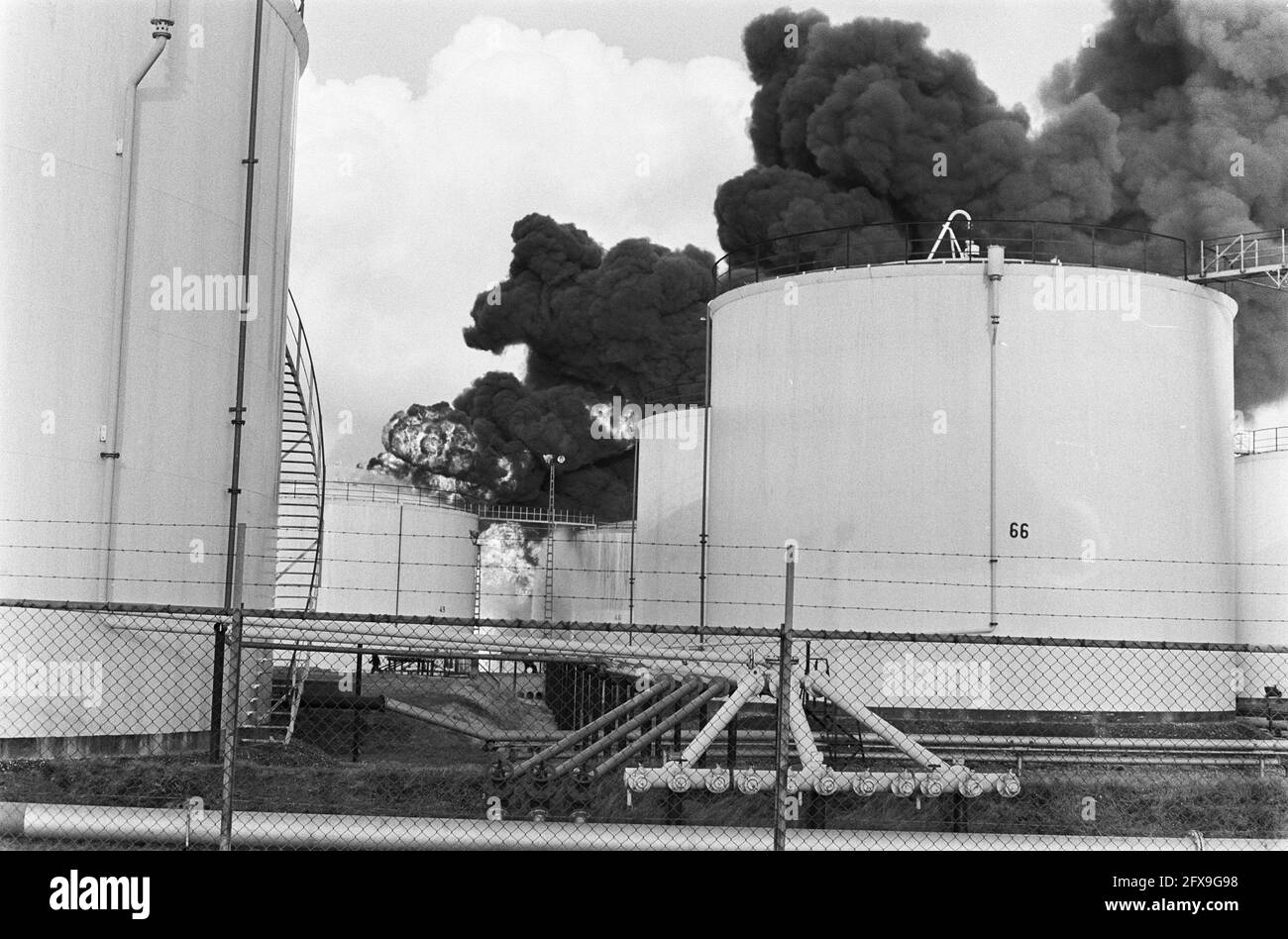 Burning gasoline storage tank amidst hi-res stock photography and ...
