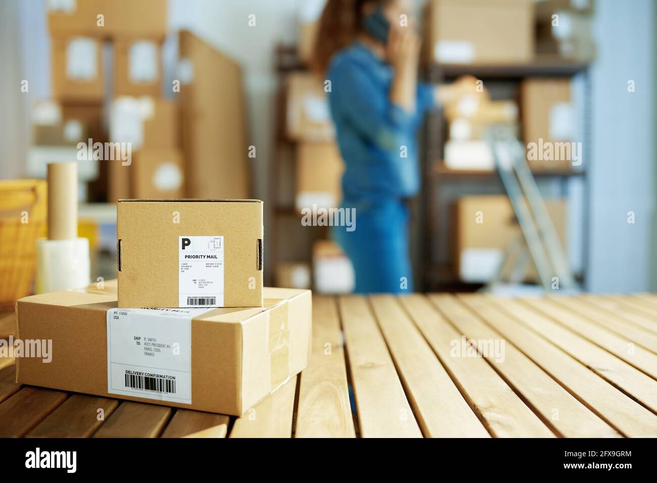 Delivery business. table with parcels in the office Stock Photo - Alamy