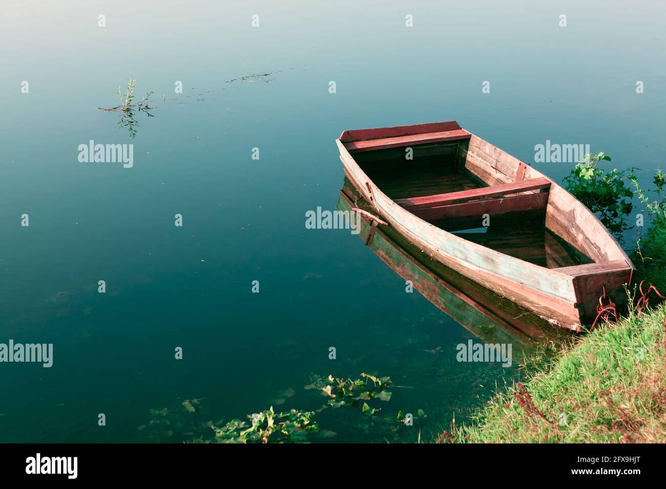 Old rowing boat filled with water hi-res stock photography and images ...