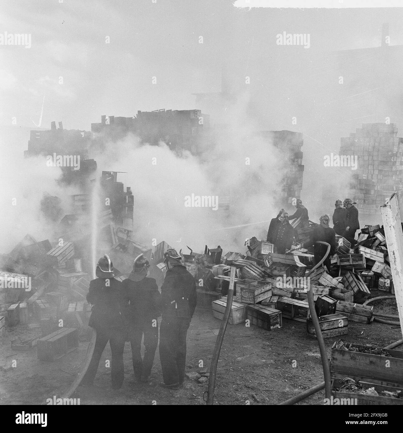 Fire on site Central market halls, overview of burning stacks of crates ...