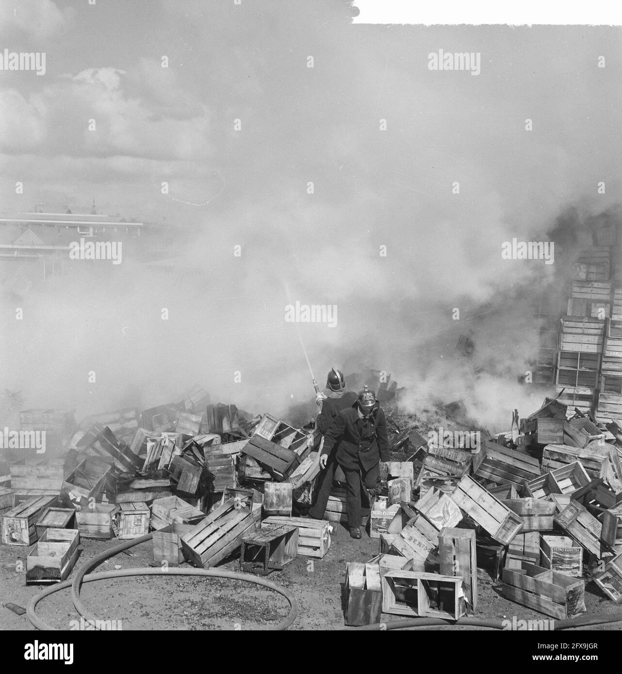 Fire on site Central market halls, overview of burning stacks of crates ...