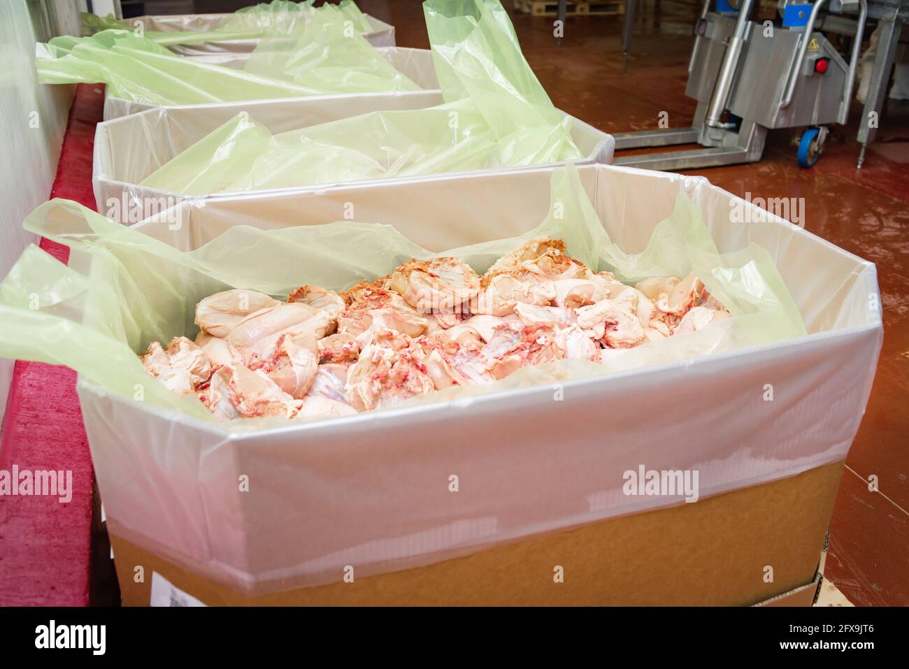 Chicken feet, chicken feet that are cut into many pieces in a large box ...