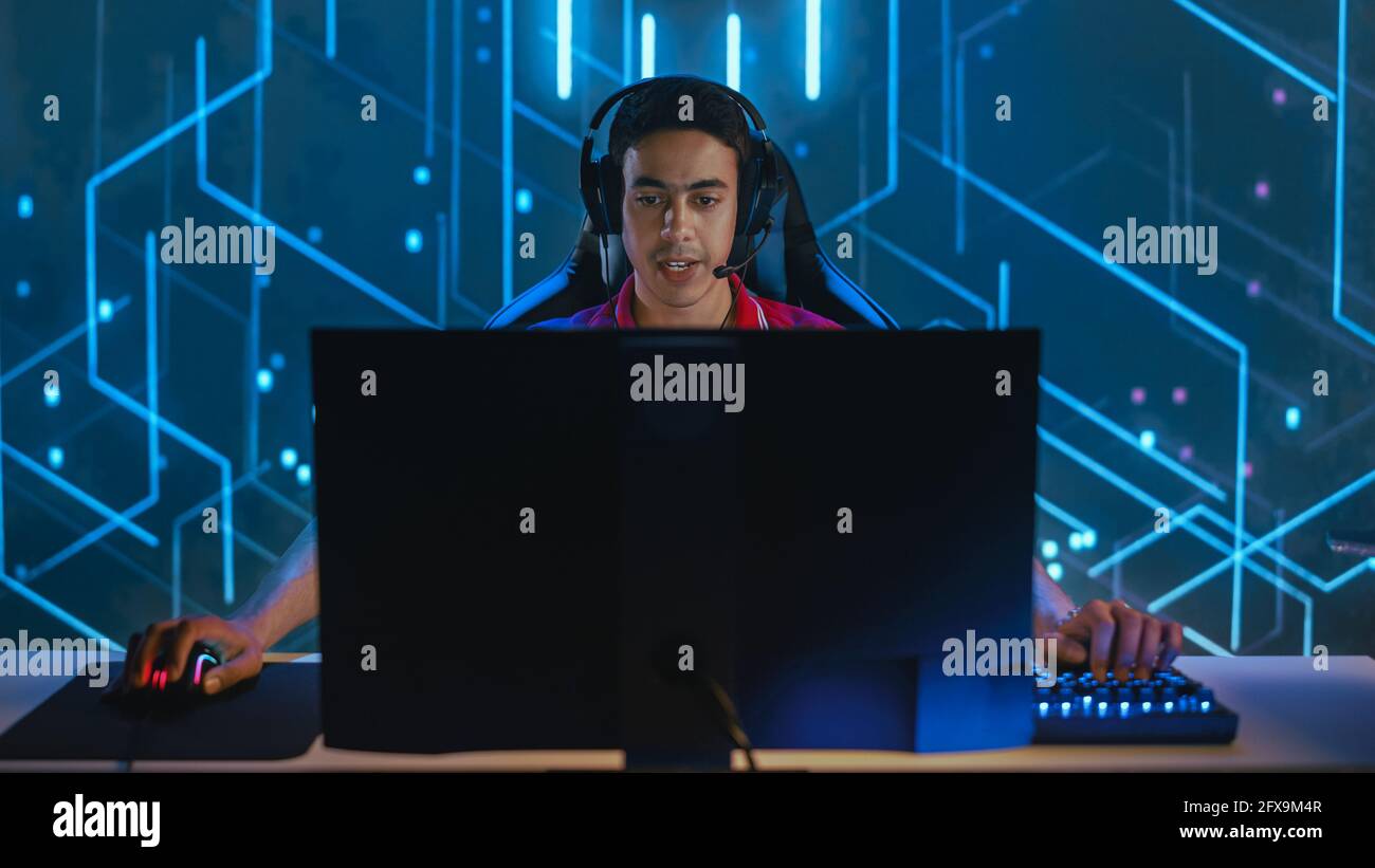 Professional eSports Gamer Playing in Computer Video Games. Background ...