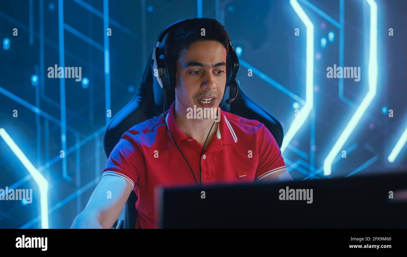 Professional eSports Gamer Playing in Computer Video Games. Background ...