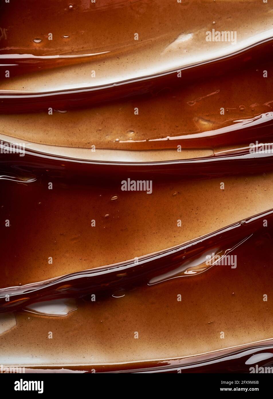 Chocolate colored gel smear and texture. Cosmetic gel or caramel syrup ...