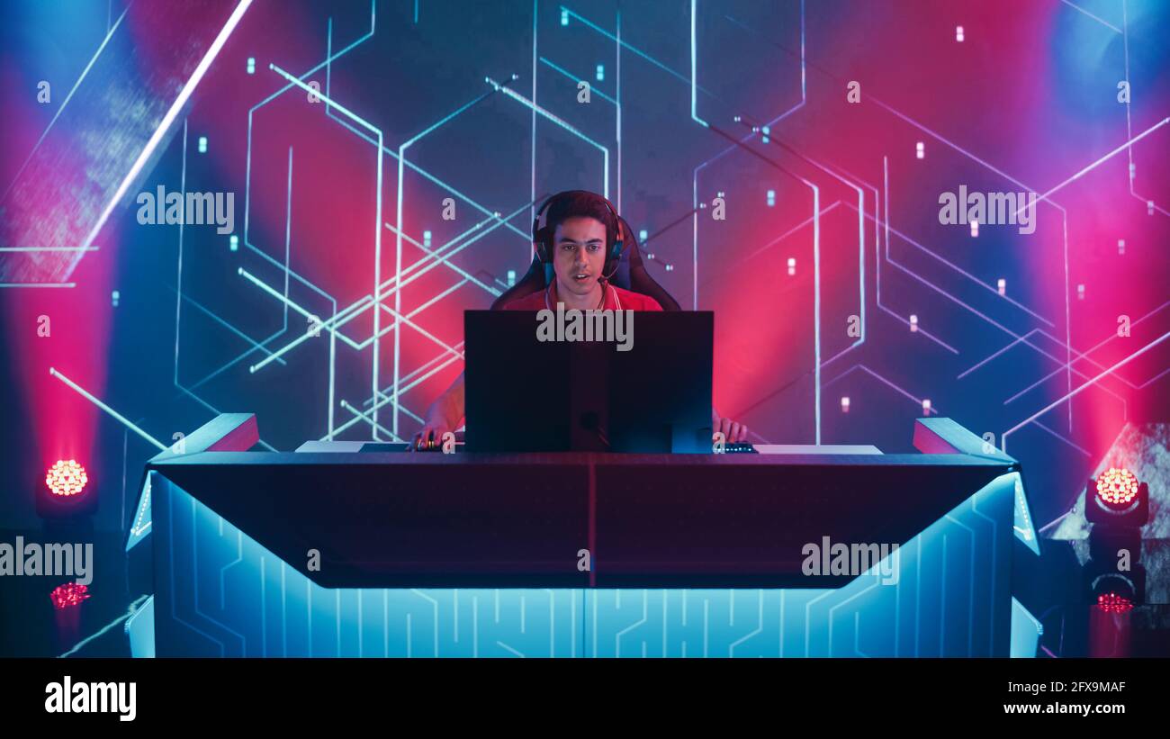 Professional eSports Gamer Playing in Computer Video Games. Background ...