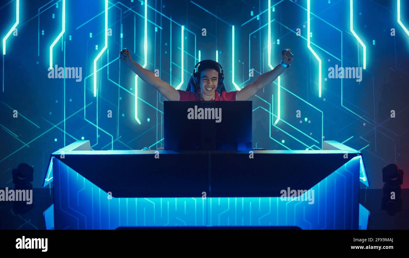 Professional eSports Gamer Playing in Computer Video Games, Happily and ...