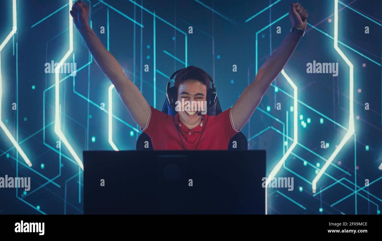 Professional eSports Gamer Playing in Computer Video Games, Happily and ...