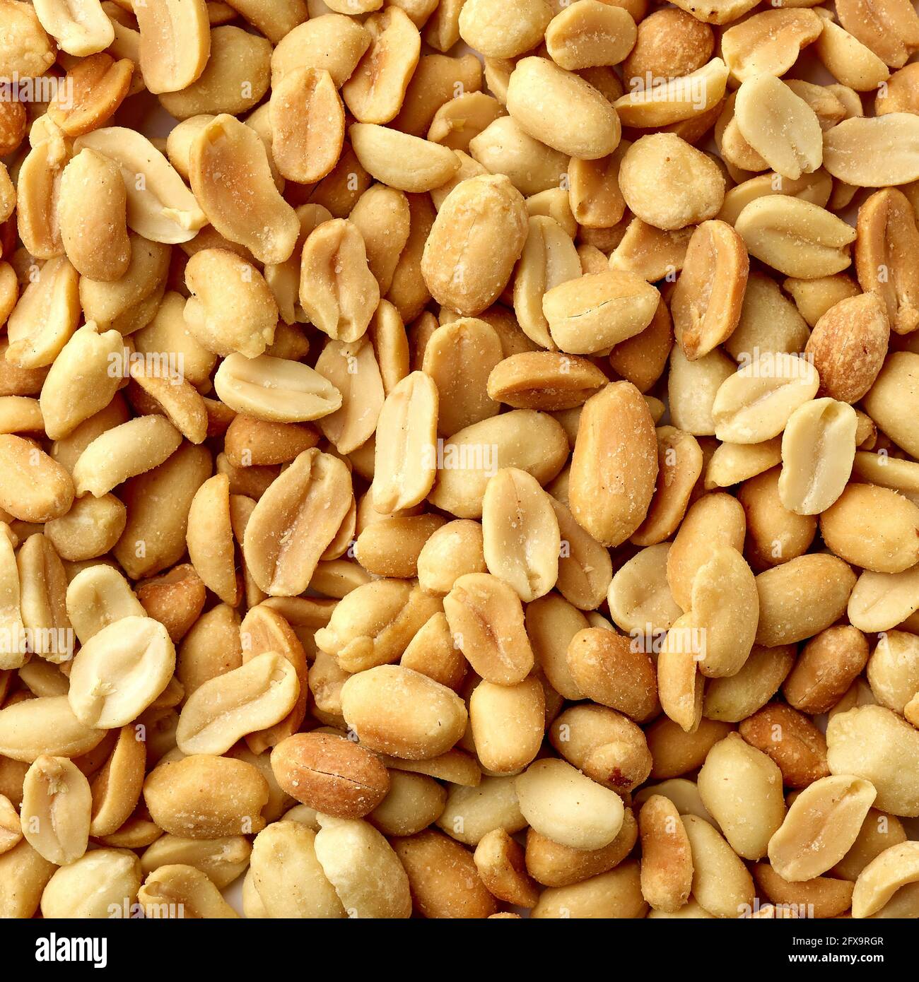 roasted salted peanut background, top view Stock Photo - Alamy