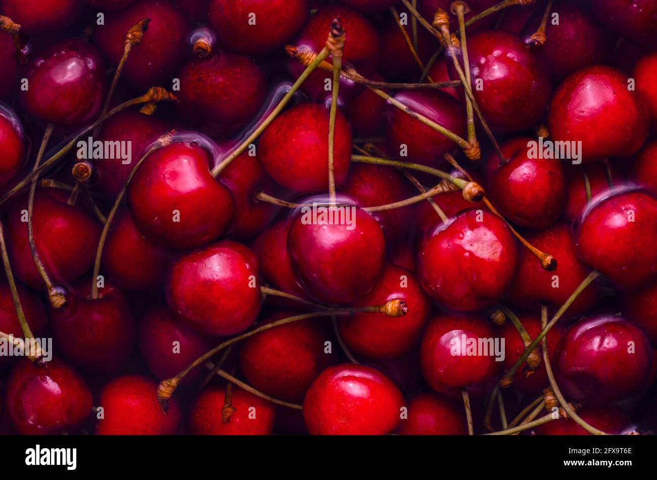 sweet red cherry background Stock Photo - Alamy