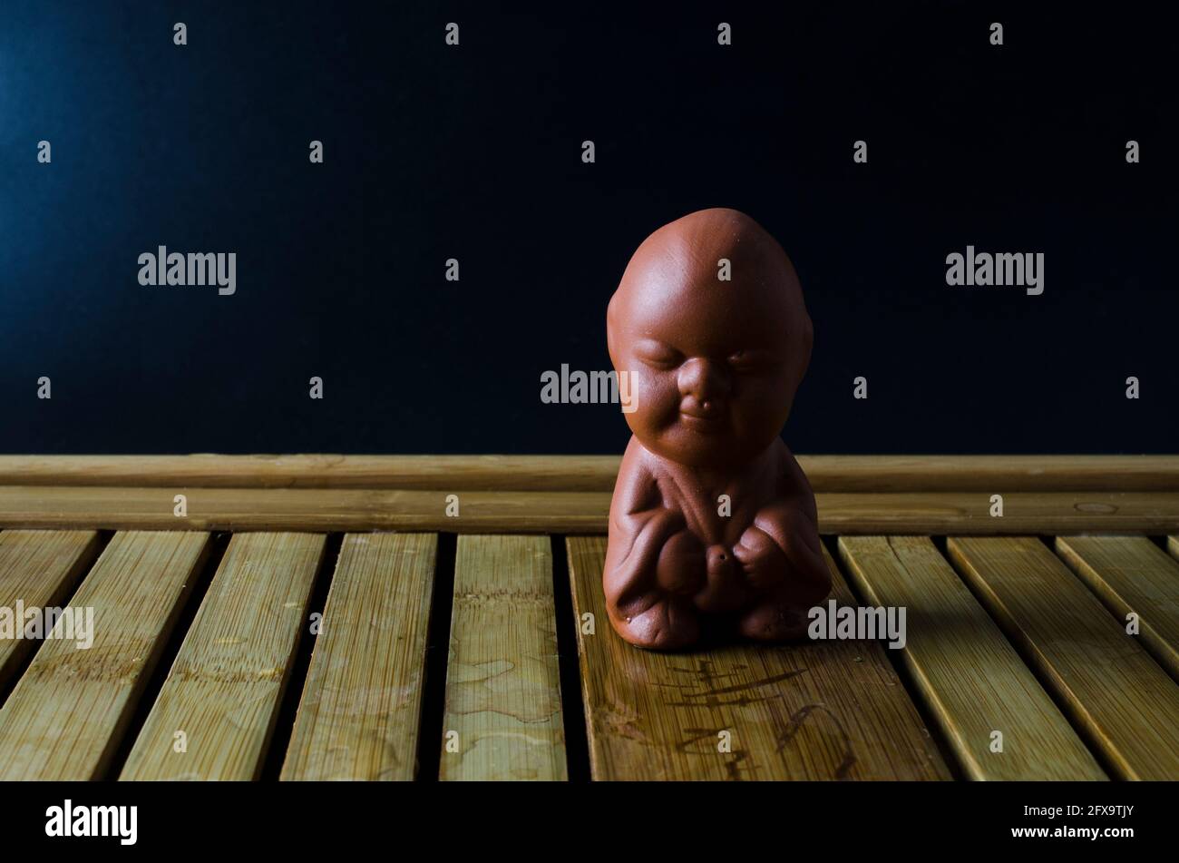 clay boy figurine for Chinese tea ceremony Stock Photo - Alamy