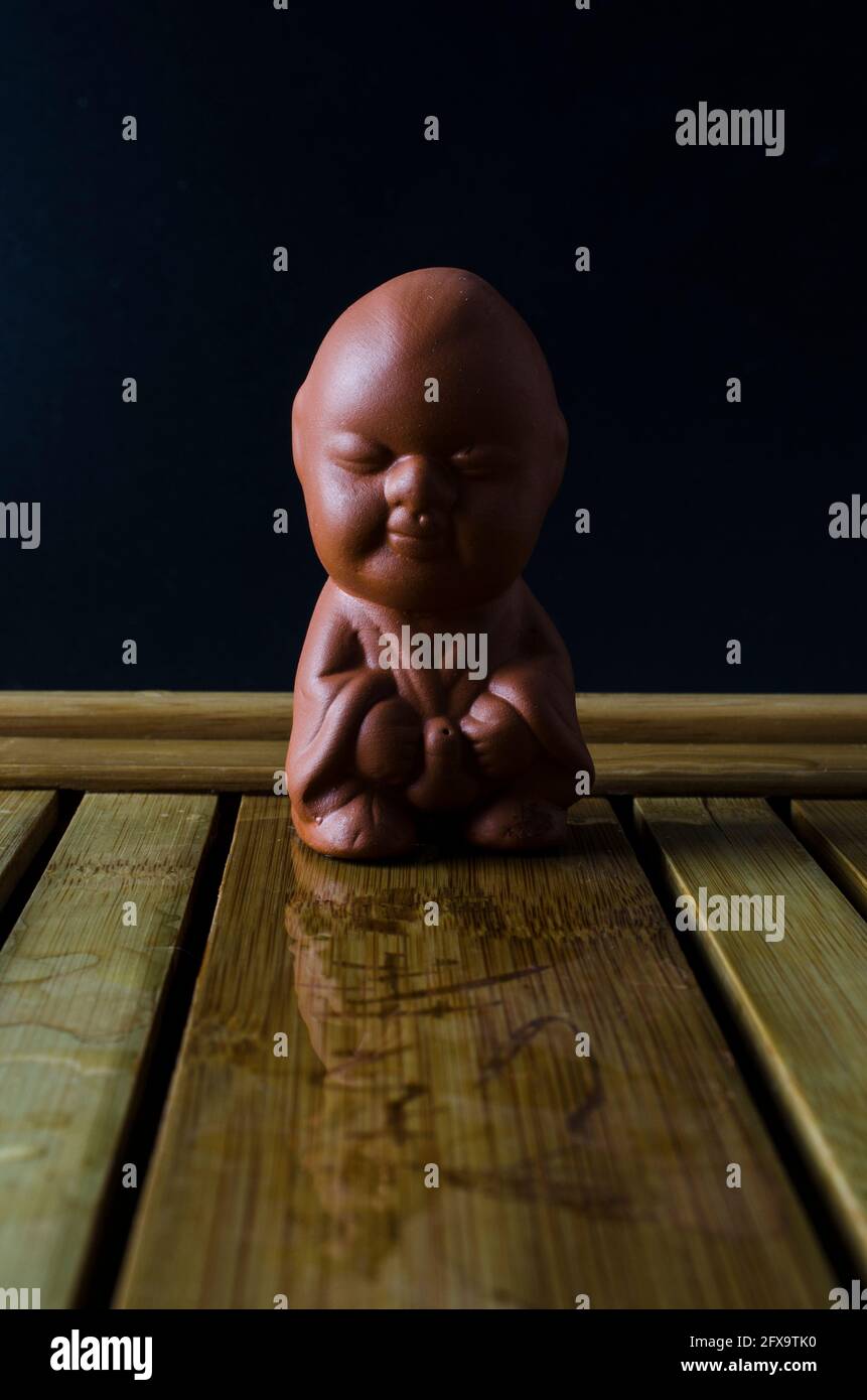 clay boy figurine for Chinese tea ceremony Stock Photo - Alamy