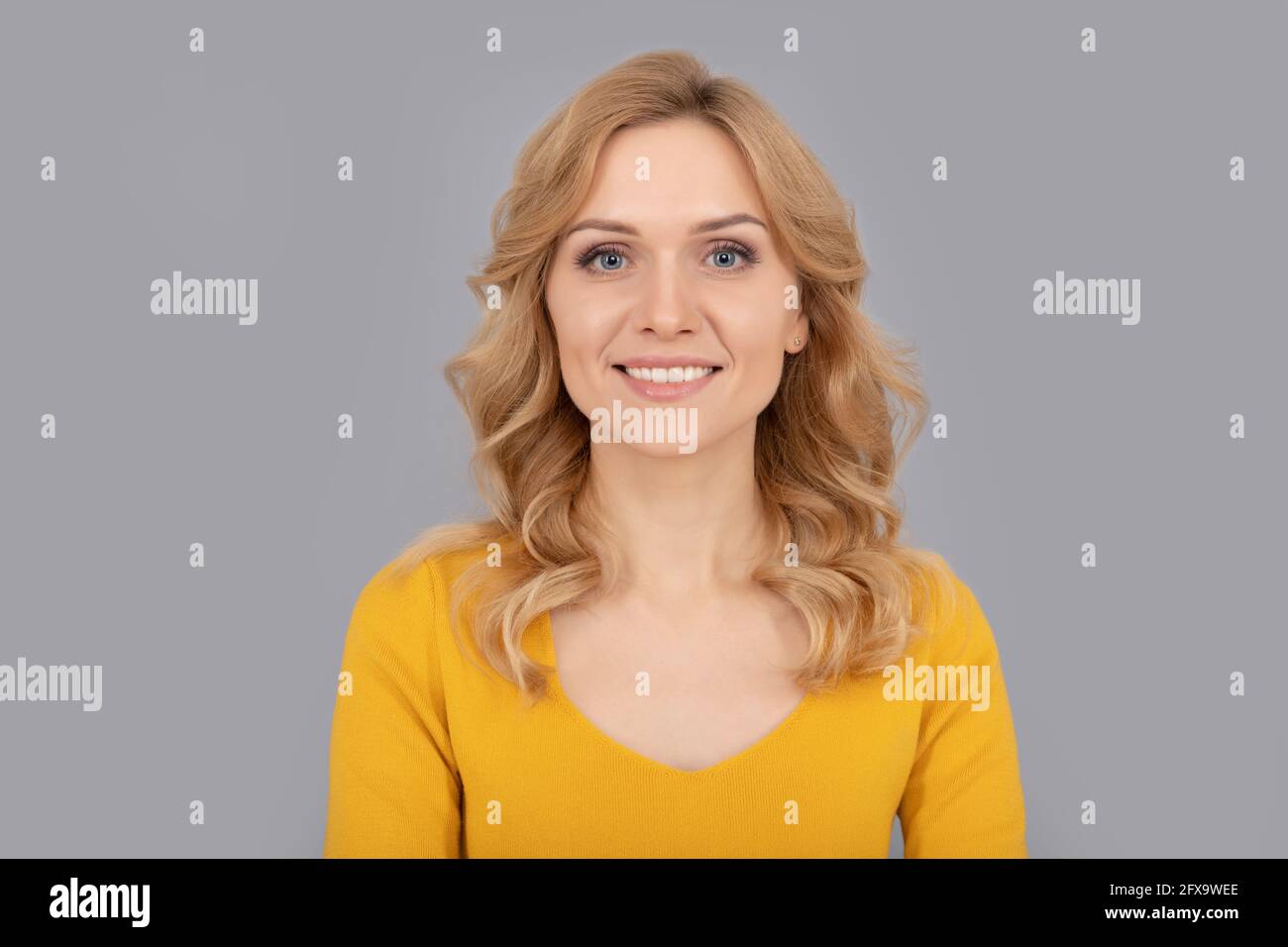 nice smile. smooth face skin. cheerful lady with curly hair. fashion ...