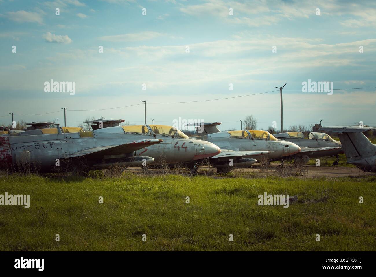 Old Soviet military aircraft standing at the airfield. Rusty used ...